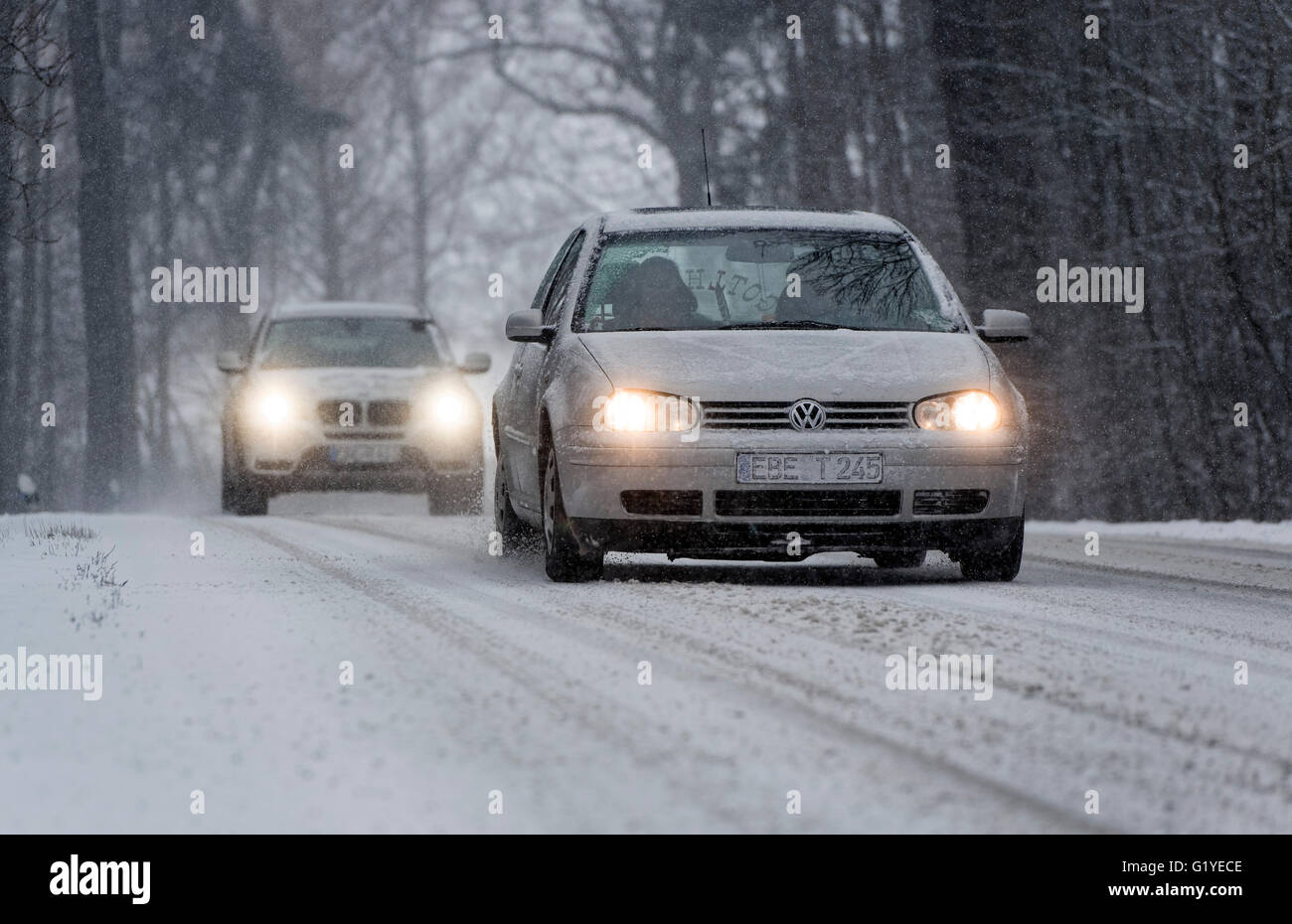 Snowy road with cars, traffic in winter conditions, Gelting, Upper ...