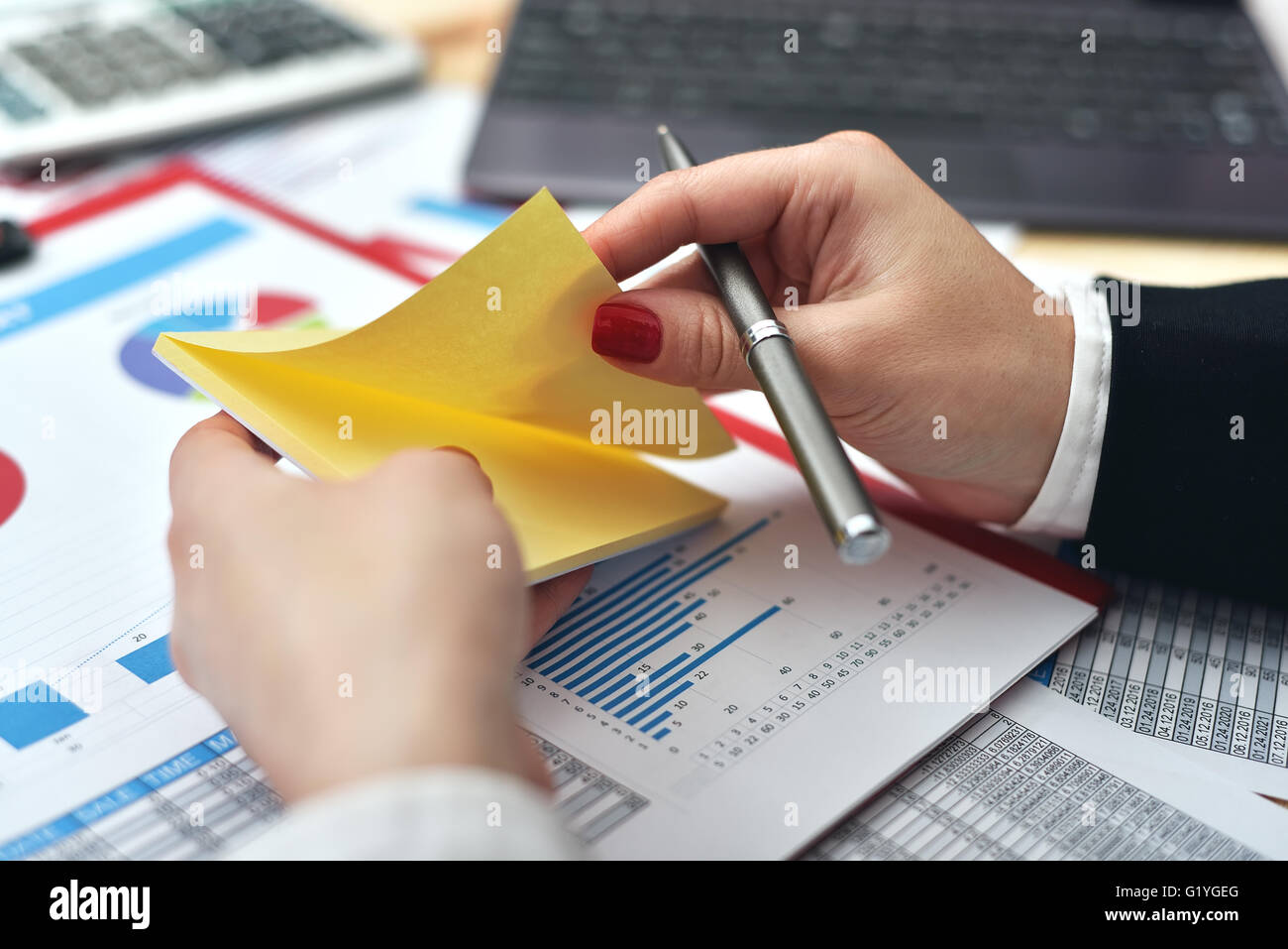 accountant woman tears off sticker, close up Stock Photo - Alamy