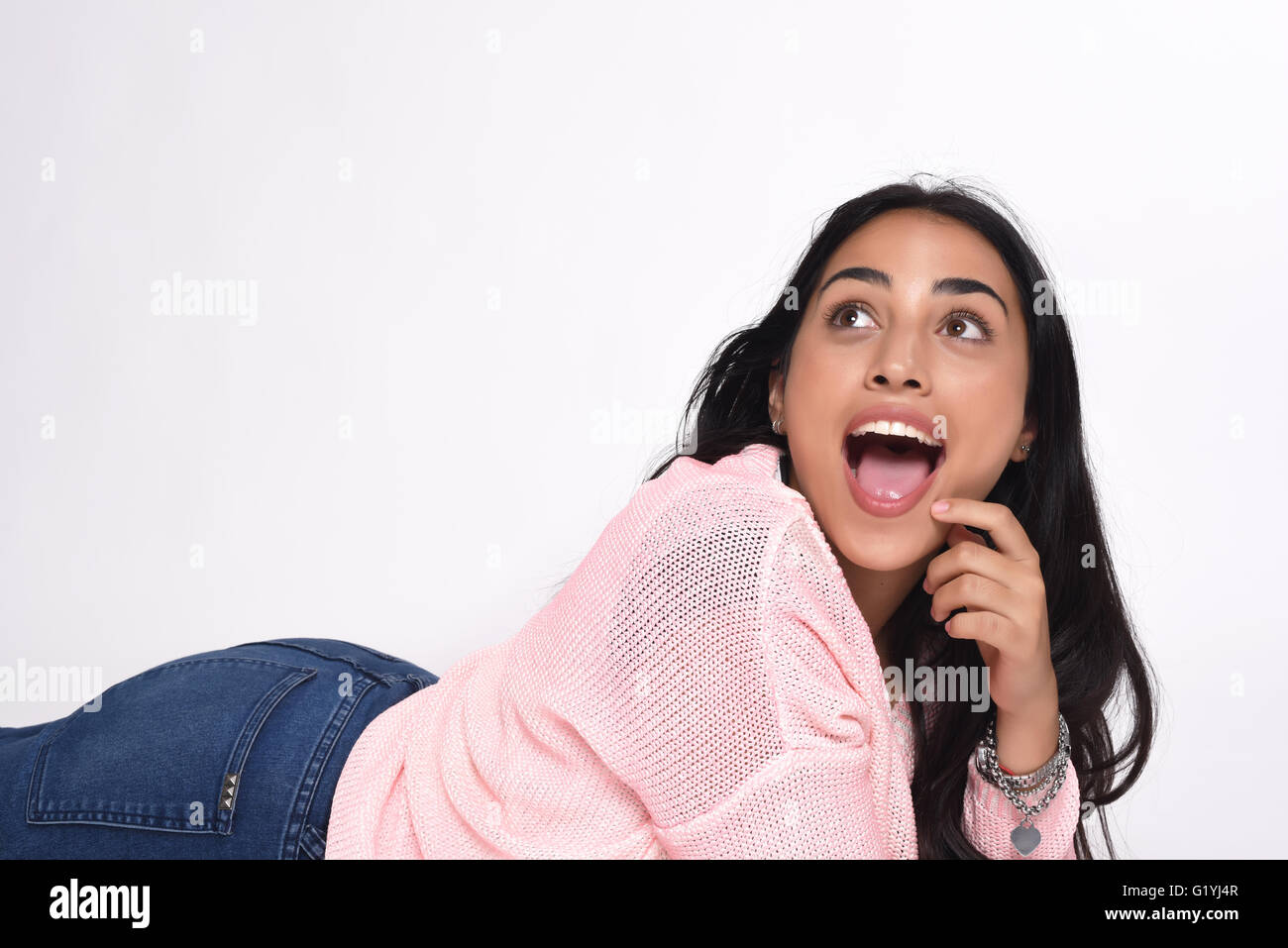 Portrait of young latin woman surprised. Isolated white background ...