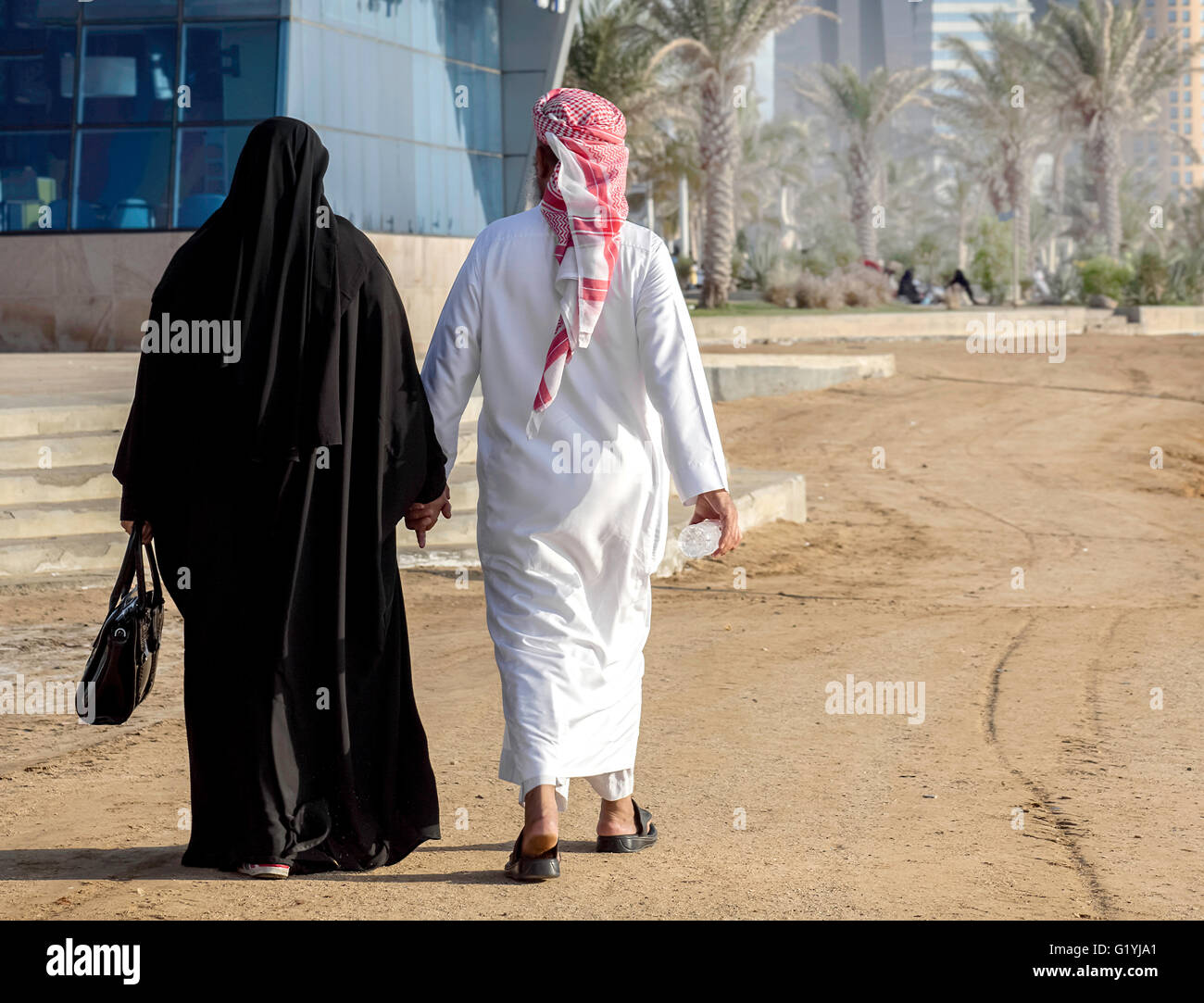 Muslim Couple Holding Hands Walking