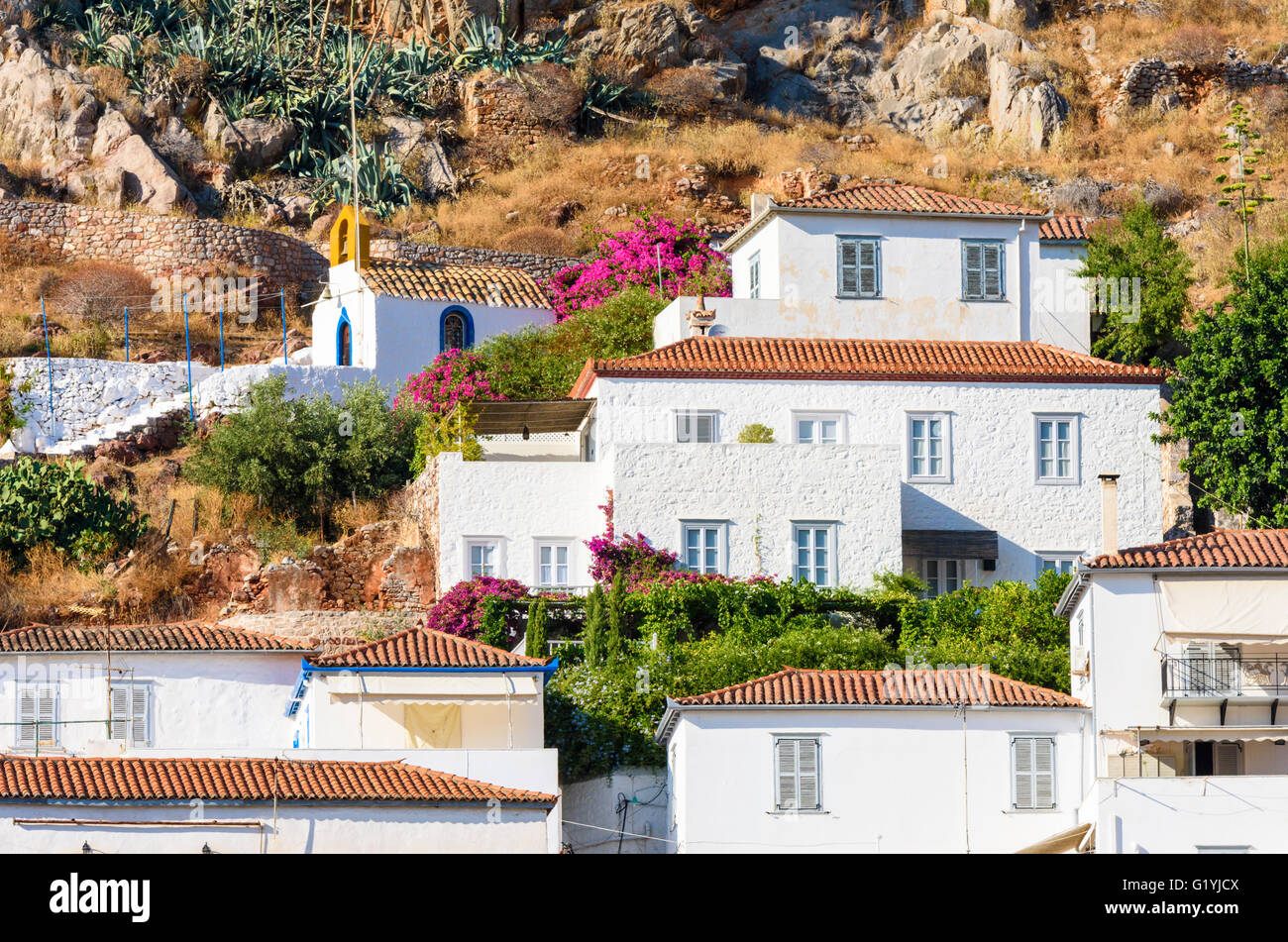 Whitewashed red roofed hillside houses and church in Hydra Town, Hydra ...