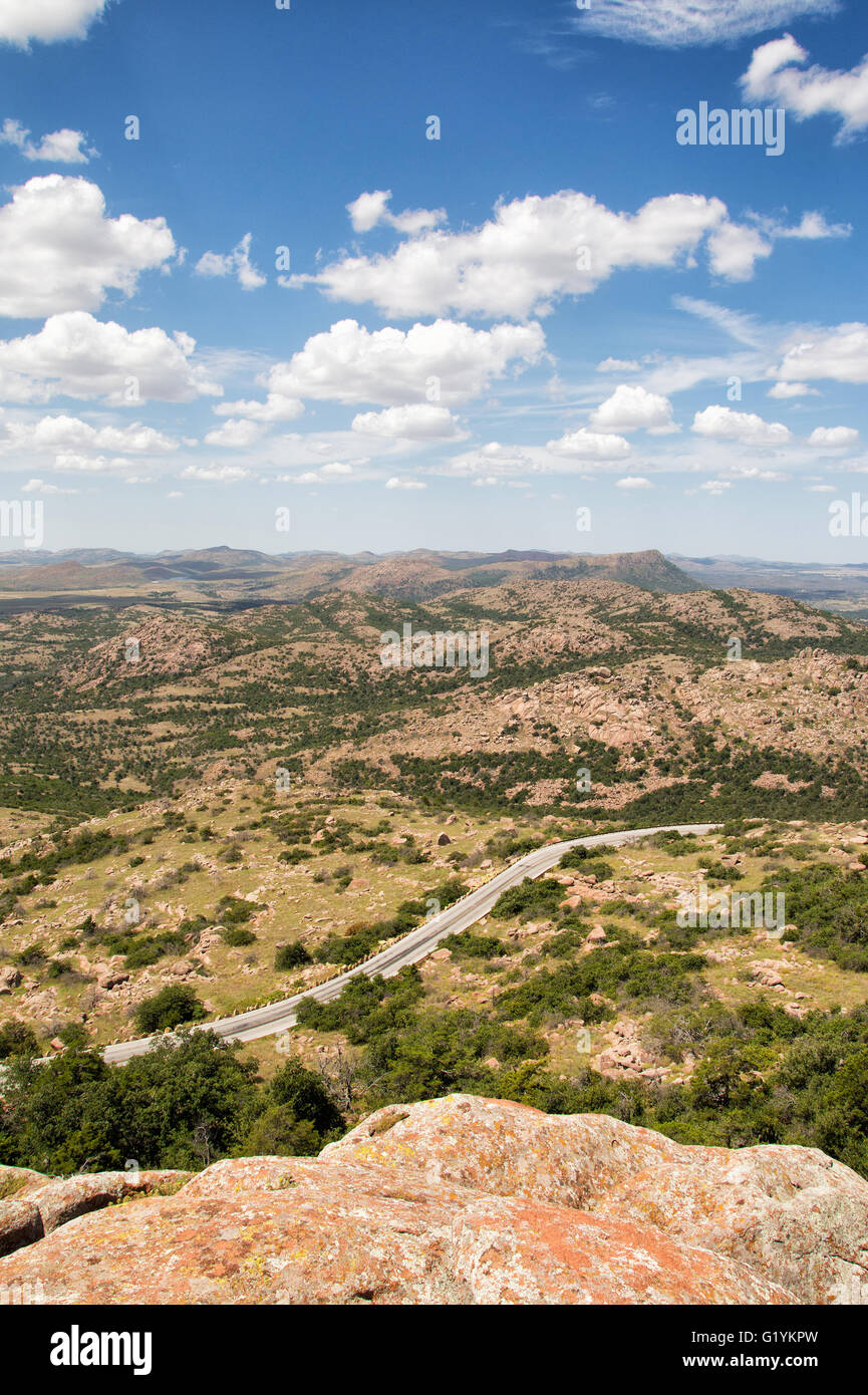 Mountain road winding through an arid landscape between outcrops of ...