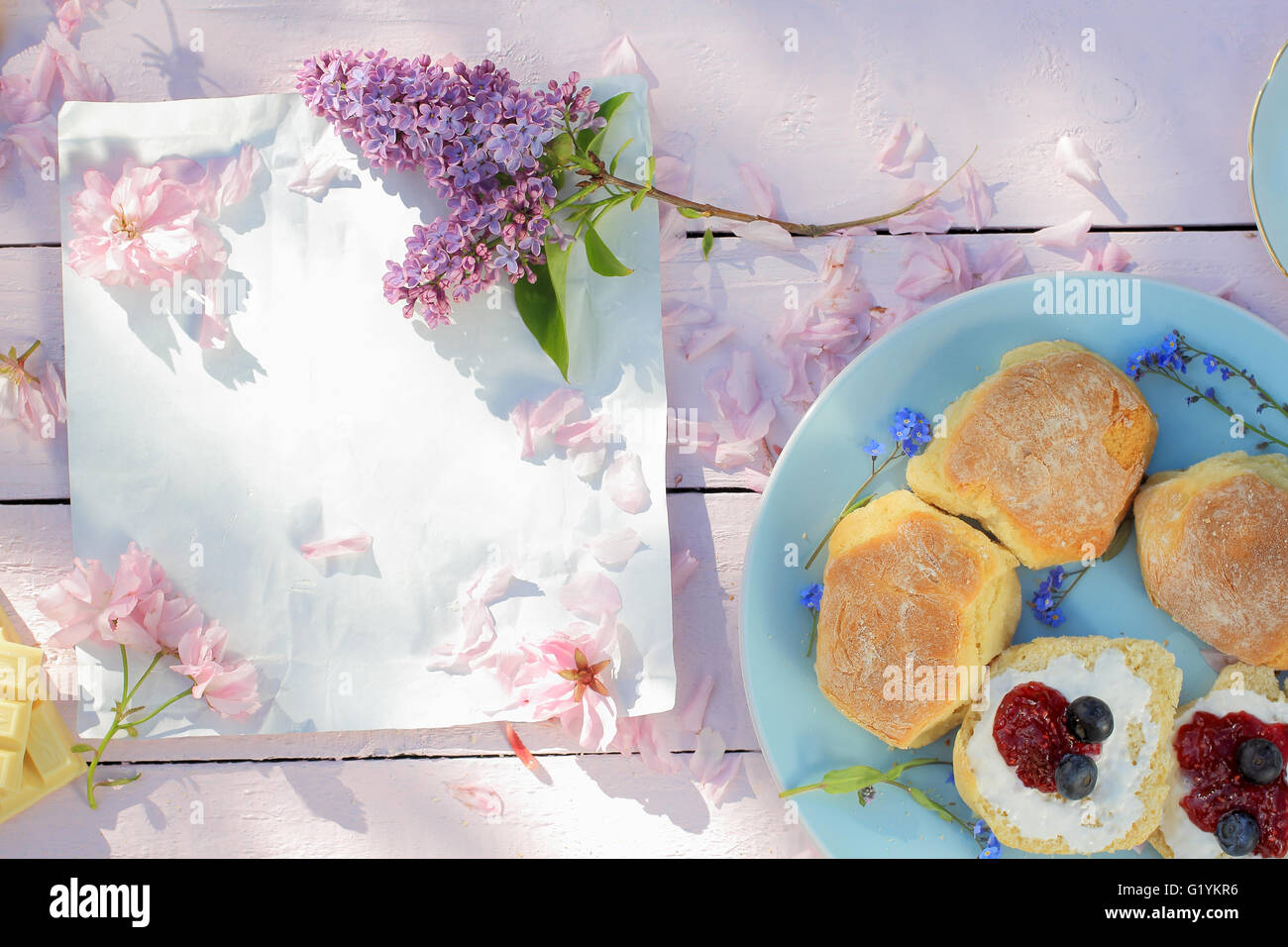 Beautiful, spring breakfast background with Scottish scones, lilac and ...