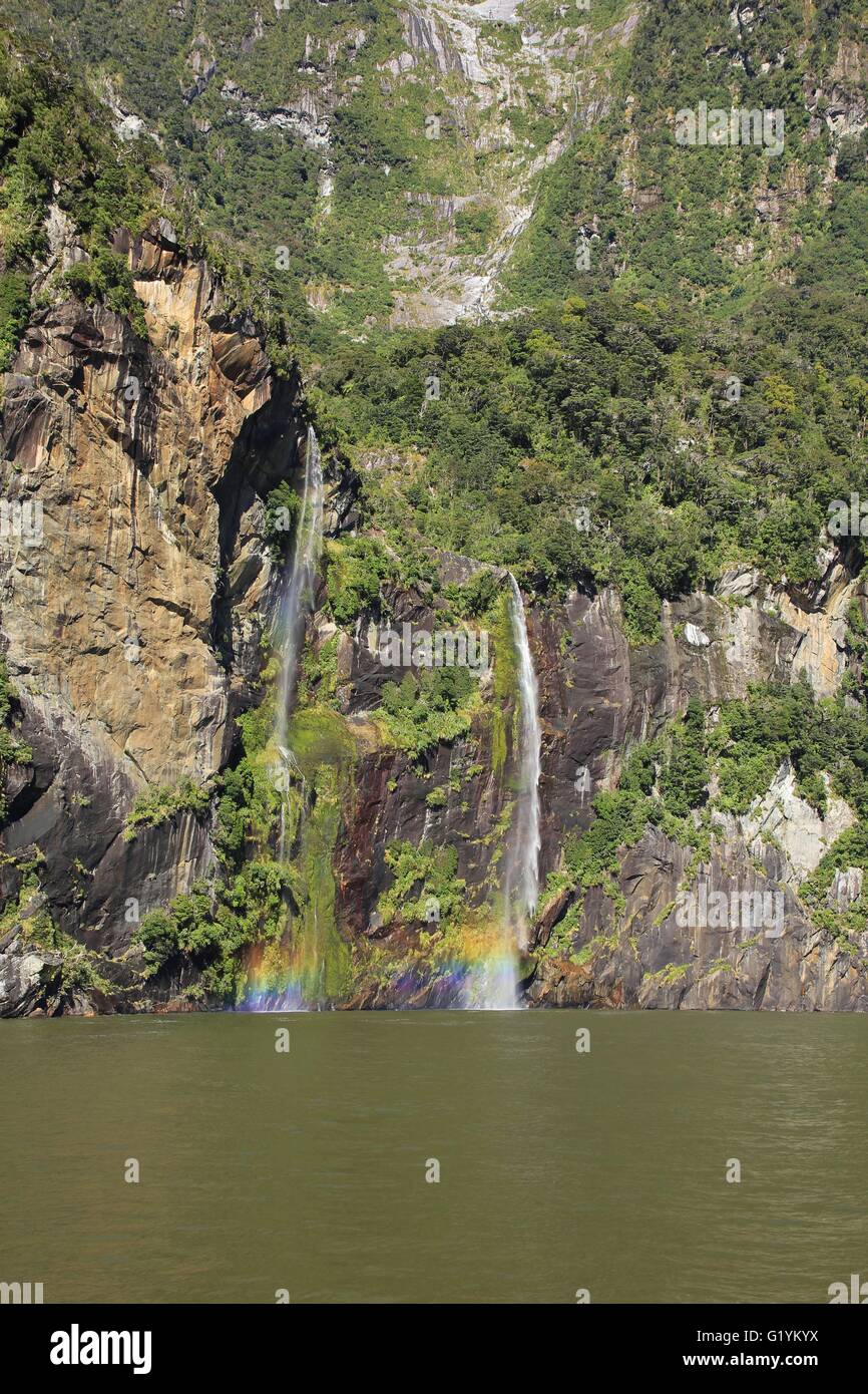 Rainbow colored waterfall in the Milford Sound Stock Photo - Alamy
