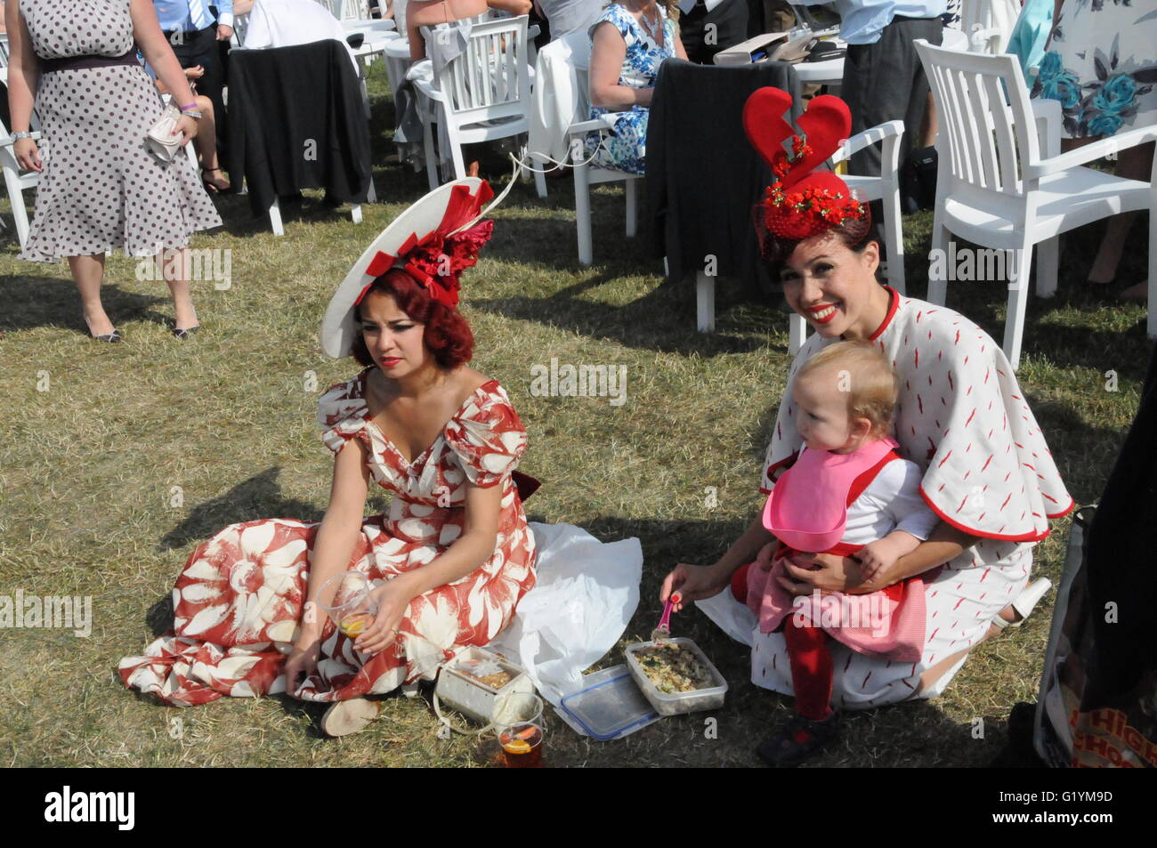 A baby is introduced to Ladies' Day at the Royal Ascot race meeting ...