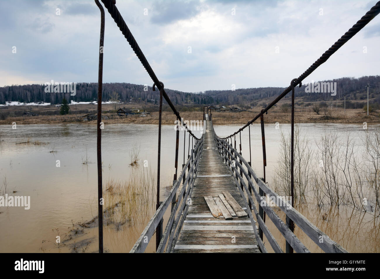 Suspended pedestrian bridge over the river Berd, in the village of ...