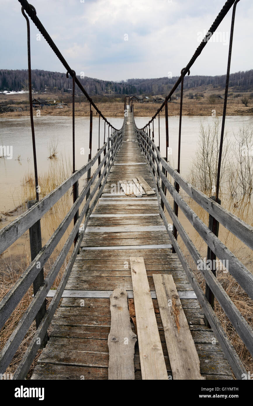Suspended pedestrian bridge over the river Berd, in the village of ...