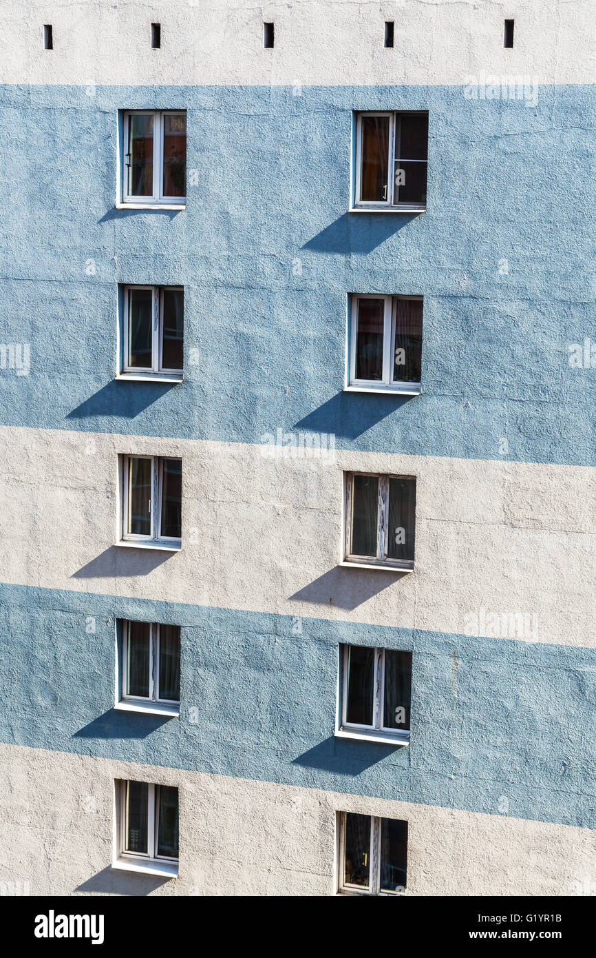Concrete wall of residential urban high-rise building with windows ...