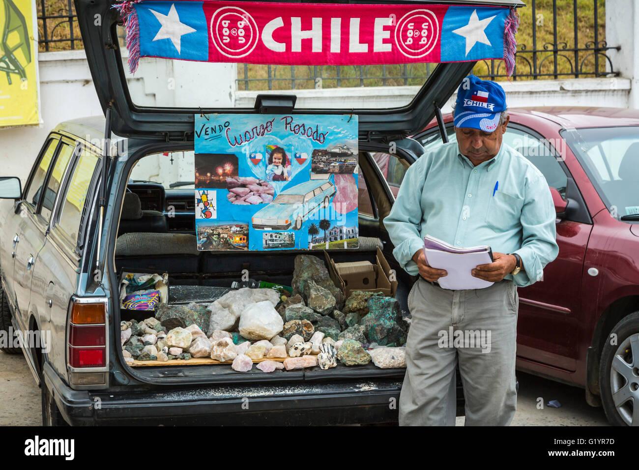 A man selling souvenir rocks from the trunk of his car in Santiago ...