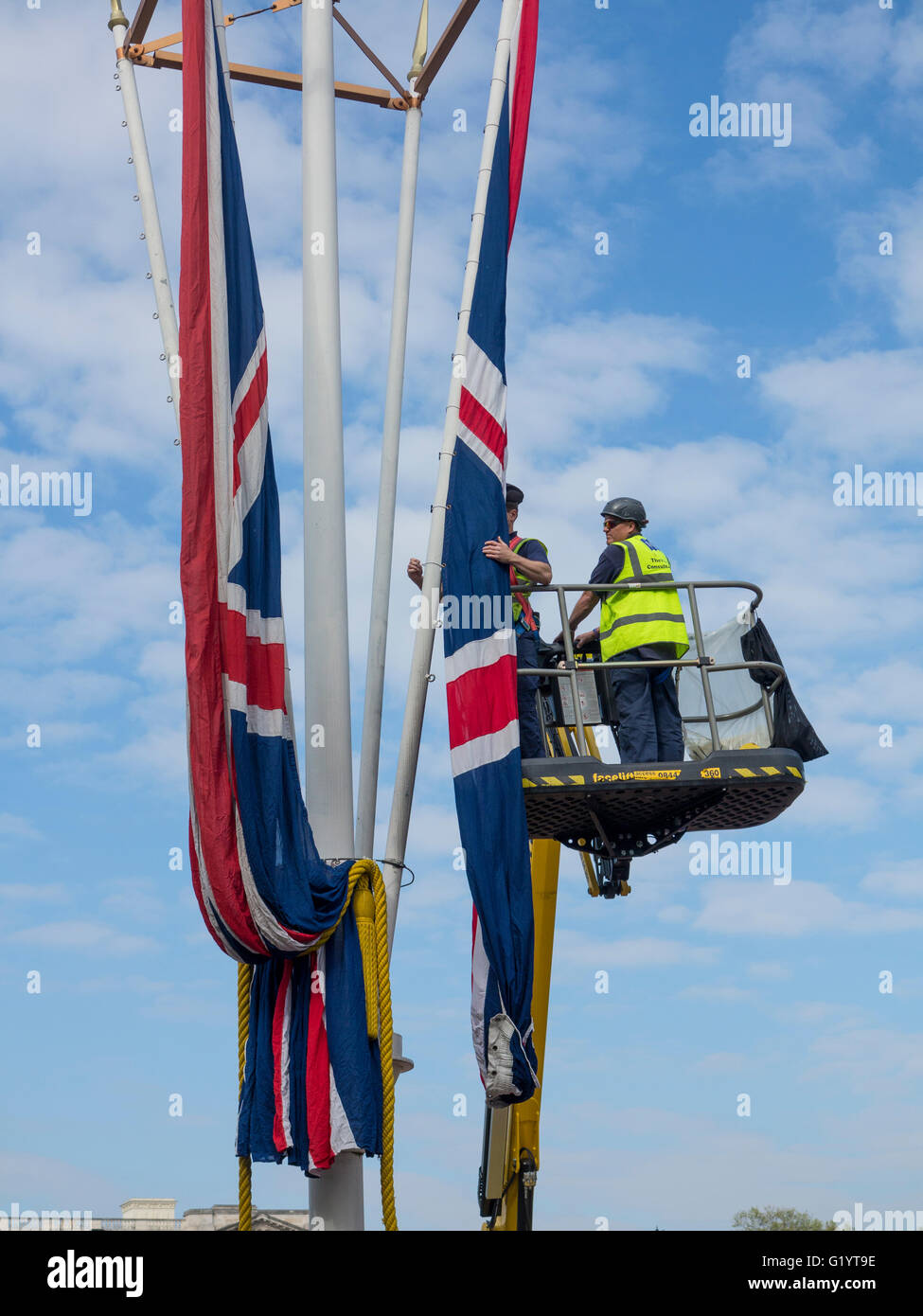 Putting up flags for the Queen's 90th Birthday celebrations Stock Photo ...