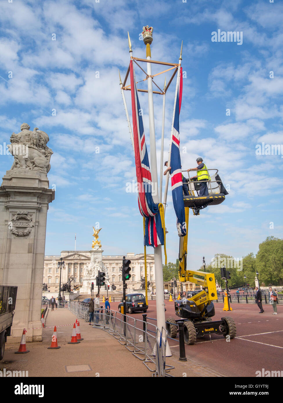 Putting up flags for the Queen's 90th Birthday celebrations Stock Photo ...