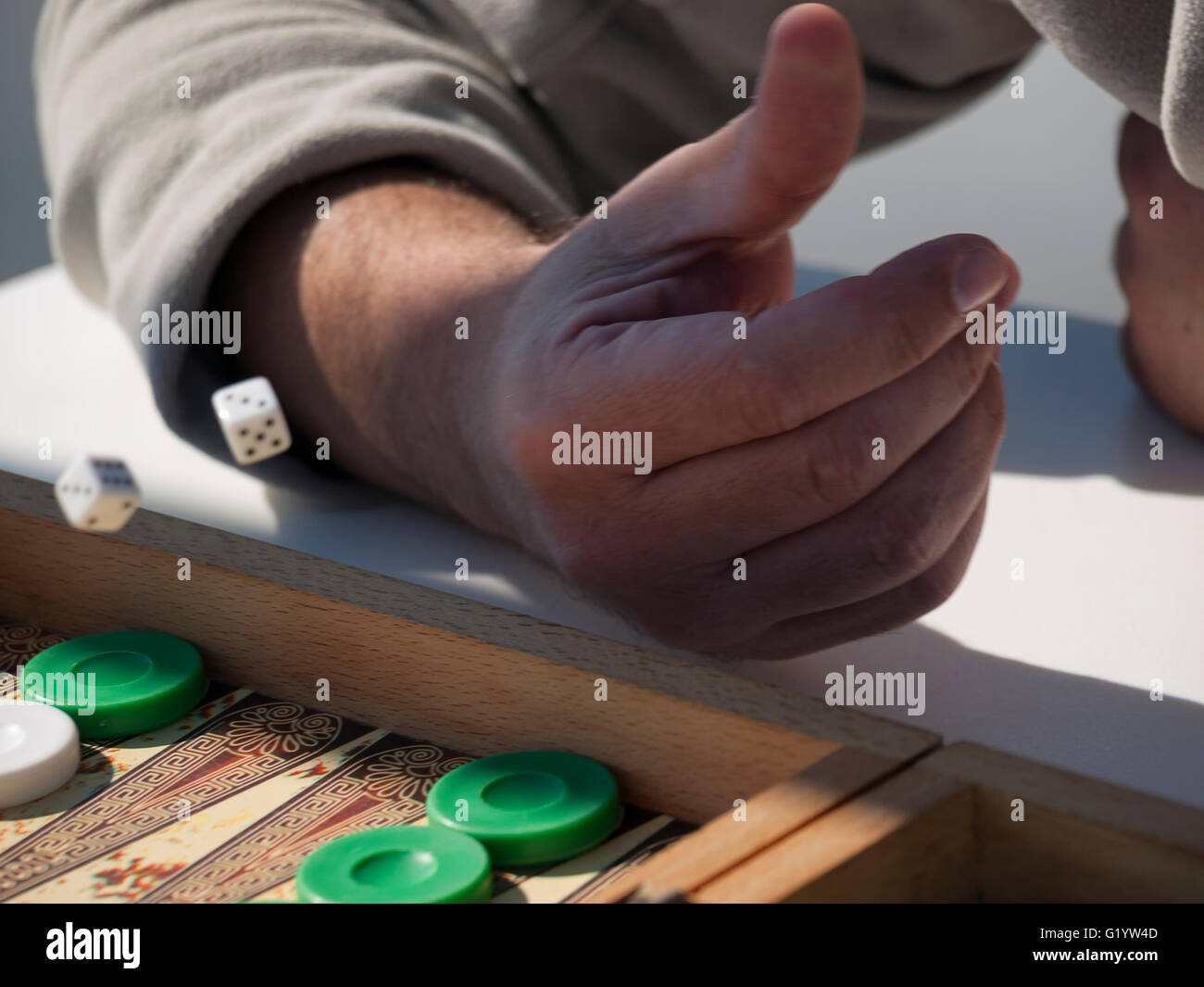 Hand with dice hi-res stock photography and images - Alamy