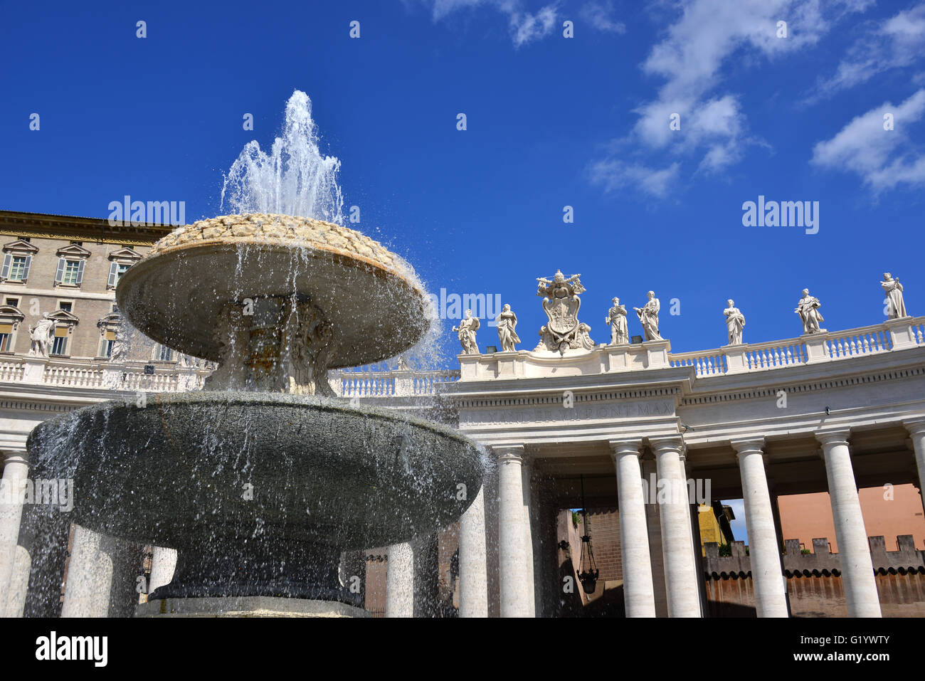 Beautiful baroque fountain and colonnade with statues of saints ...