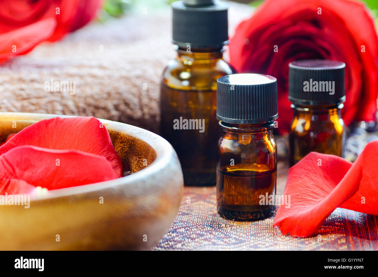 essential oils with red roses Stock Photo - Alamy