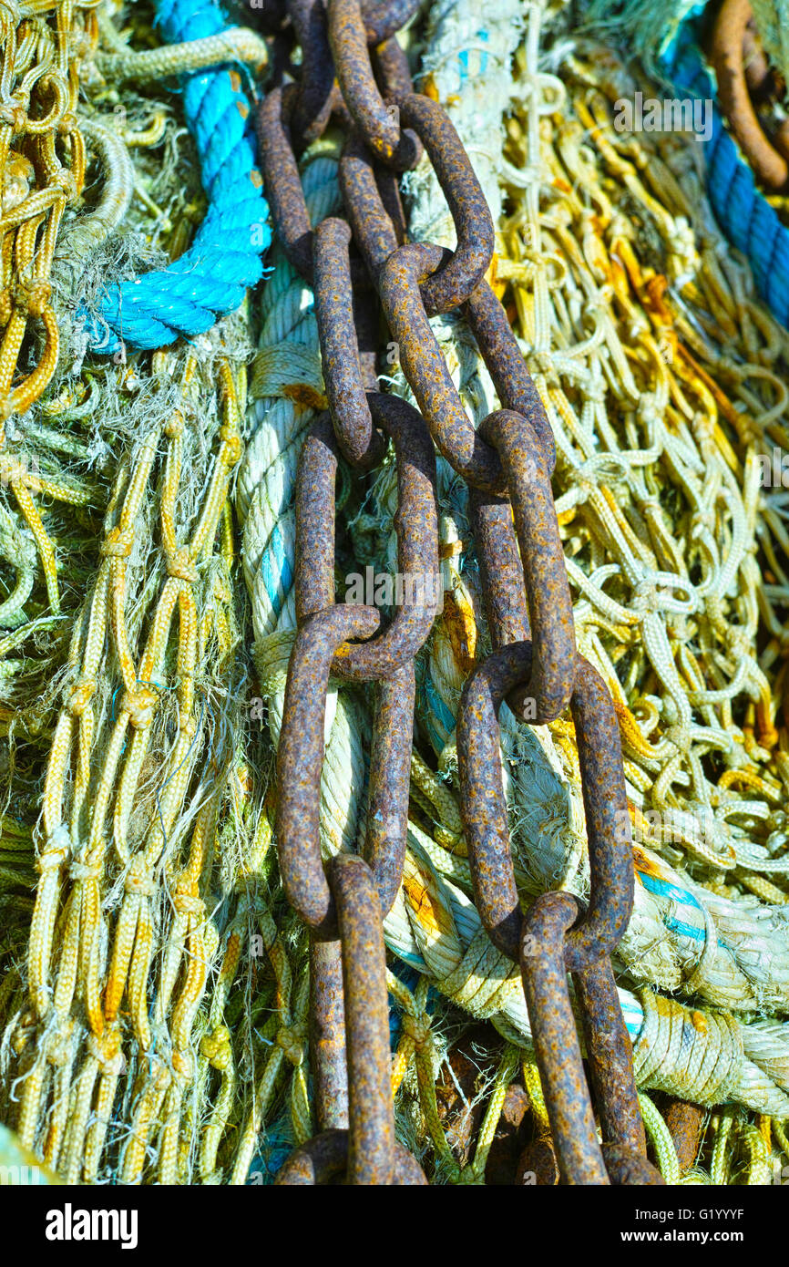 Fisherman's nets and old iron chain, background Stock Photo - Alamy