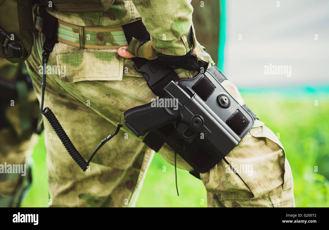 Military man gun on leg hi-res stock photography and images - Alamy