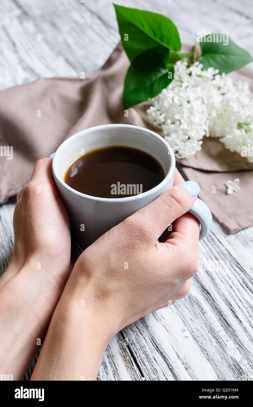 Cup of coffee in hands Stock Photo - Alamy