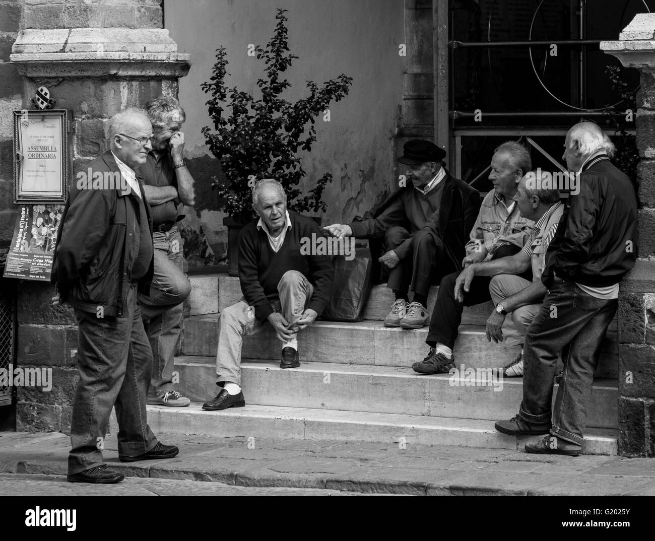 Italian men chatting on steps Stock Photo - Alamy