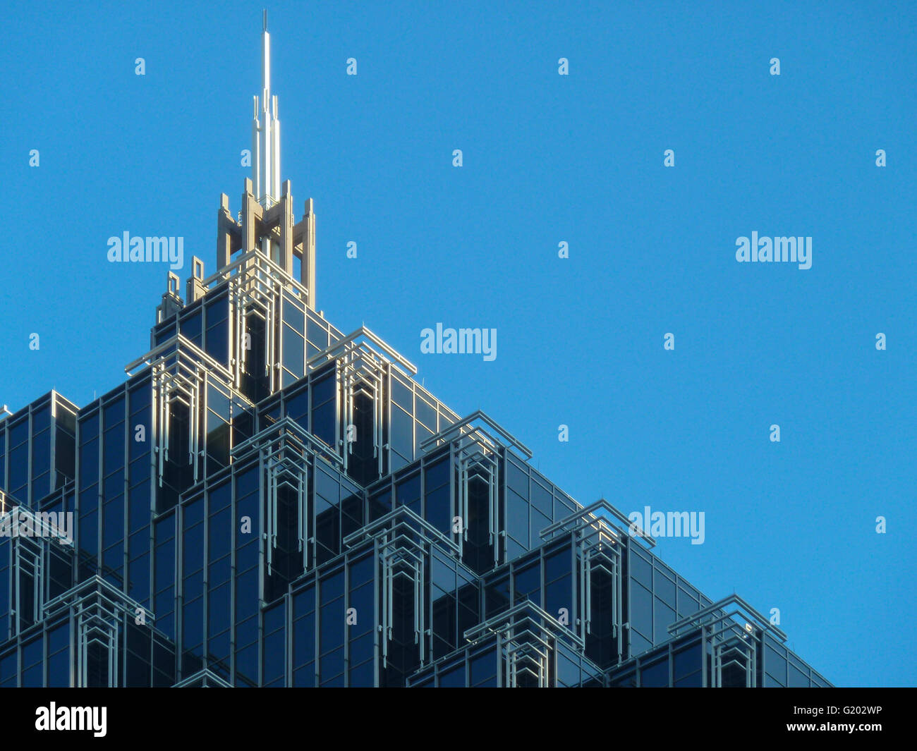a detail image of a downtown Atlanta high rise with a spire on top ...