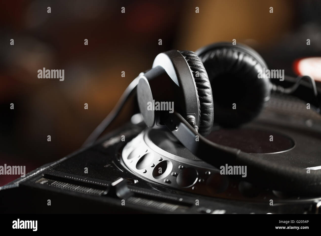 Headphones on CD music disc player for DJ. Top class audio equipment ...