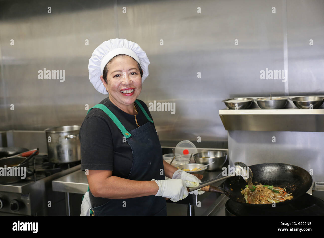 Woman chef in kitchen hi-res stock photography and images - Alamy