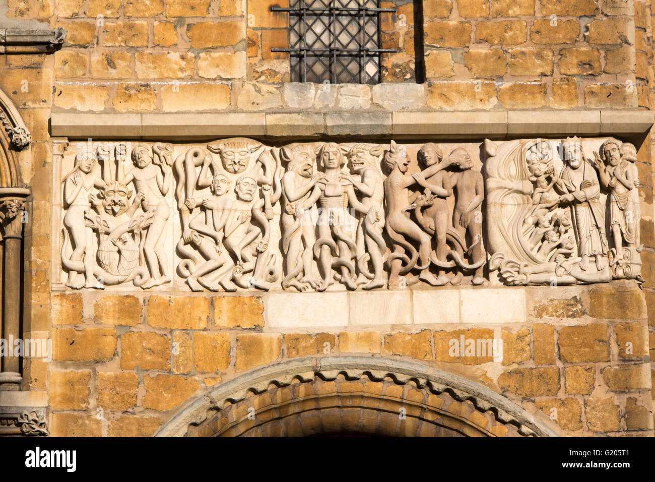 Restored Romanesque frieze of the torments of the damned in hell on ...