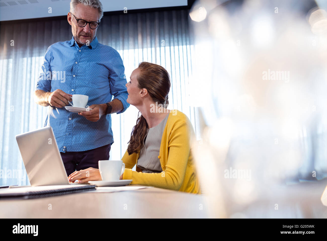 Two businessmen having a break at work Stock Photo - Alamy