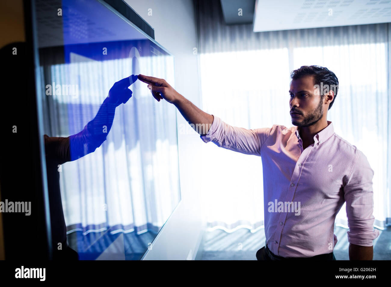 Businessman using touch screen Stock Photo - Alamy