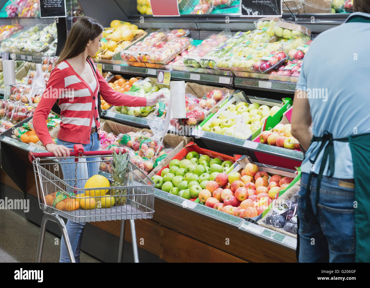 Woman selecting her fruits and vegetables Stock Photo - Alamy