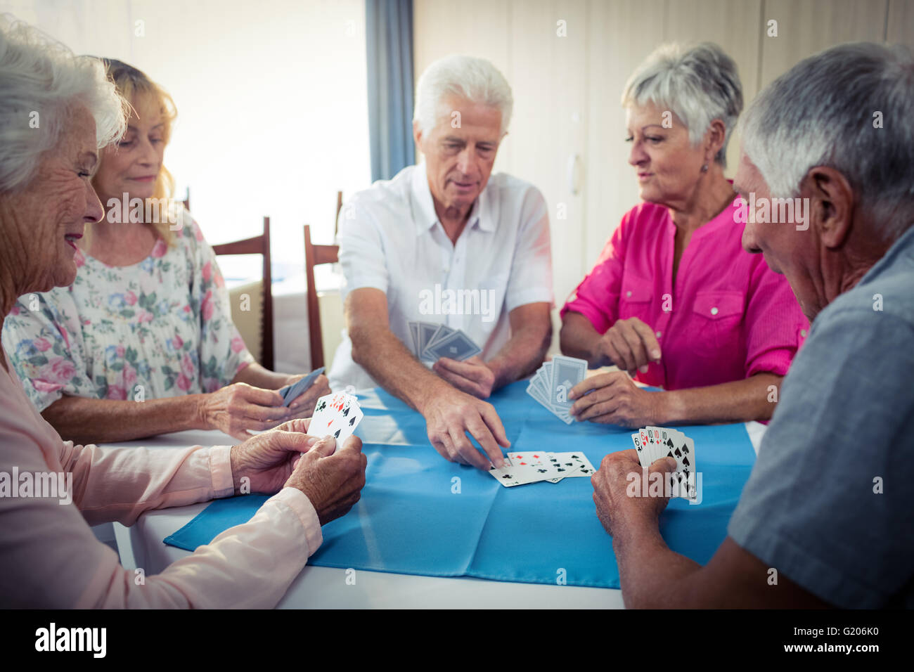 Group of seniors playing cards Stock Photo - Alamy