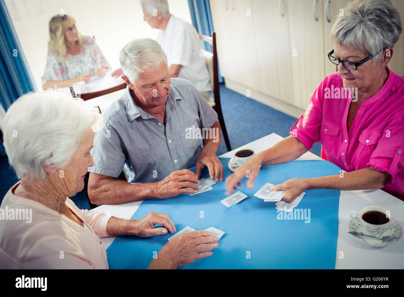 Group of seniors playing cards Stock Photo - Alamy