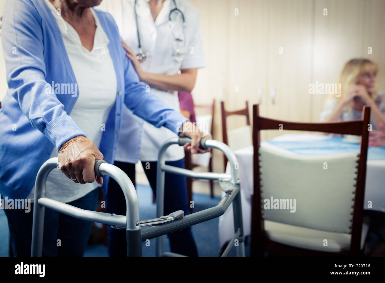 Aged woman using a walker hi-res stock photography and images - Alamy