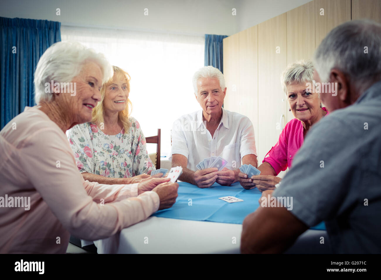 Group of seniors playing cards Stock Photo - Alamy