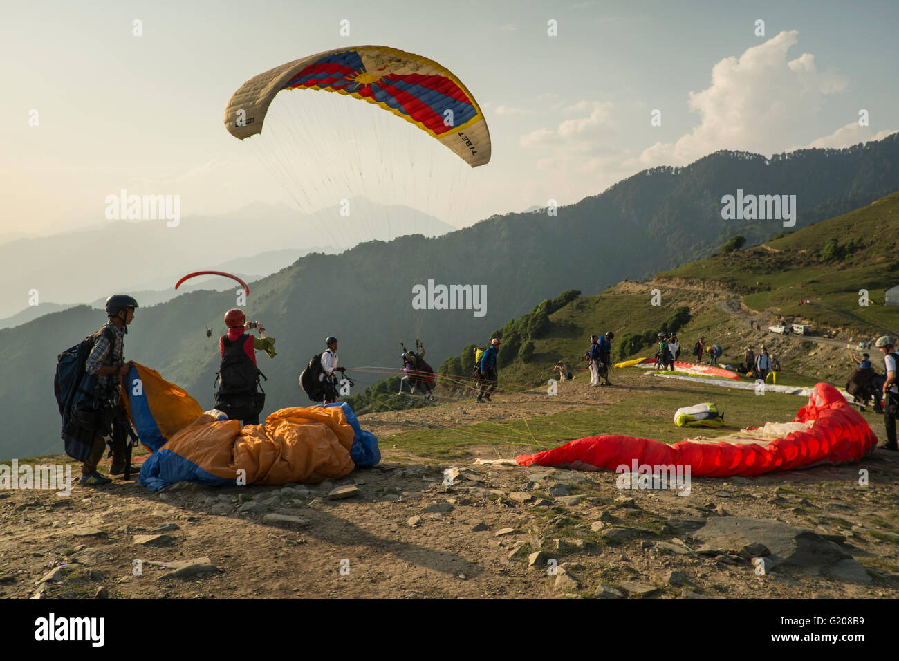 A paraglider flyer gets ready for take off at Bir Billing, Himachal ...