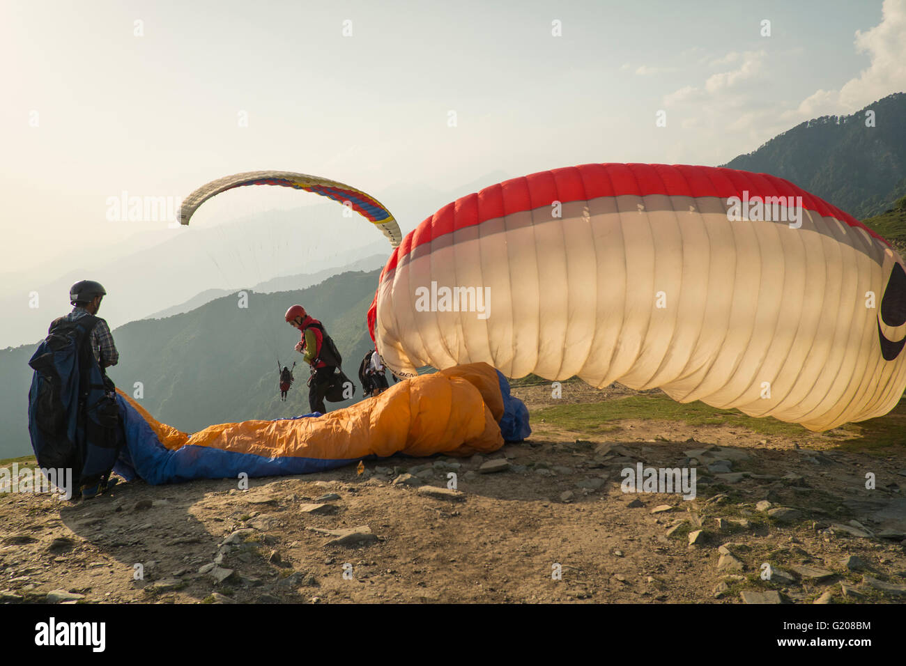 A paraglider flyer gets ready for take off at Bir Billing, Himachal ...