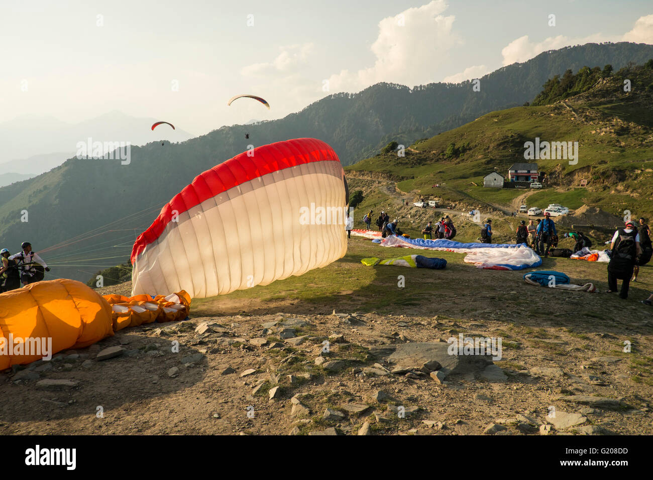 A paraglider flyer gets ready for take off at Bir Billing, Himachal ...