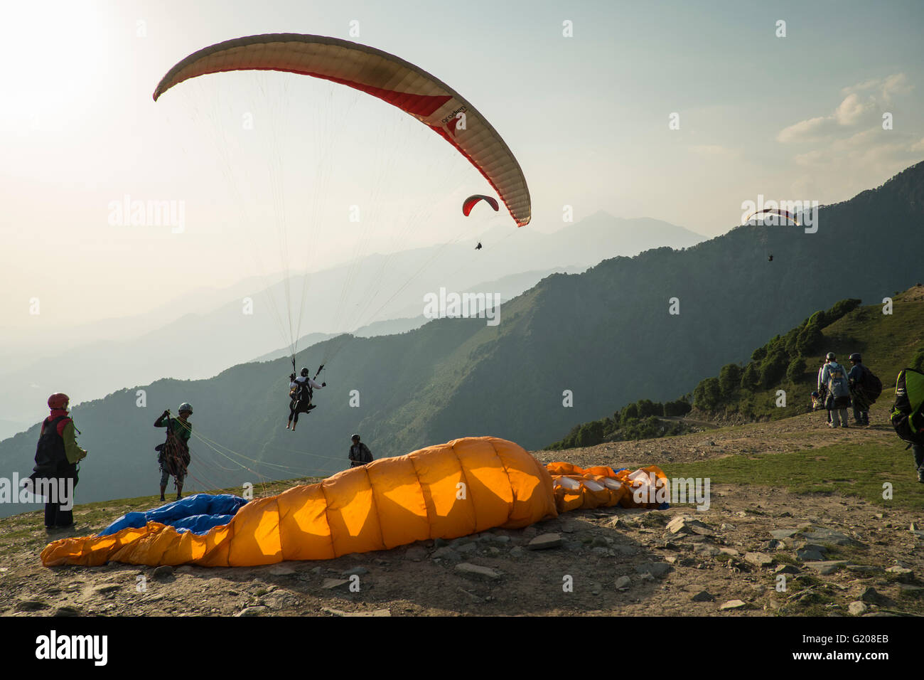 A paraglider flyer gets ready for take off at Bir Billing, Himachal ...