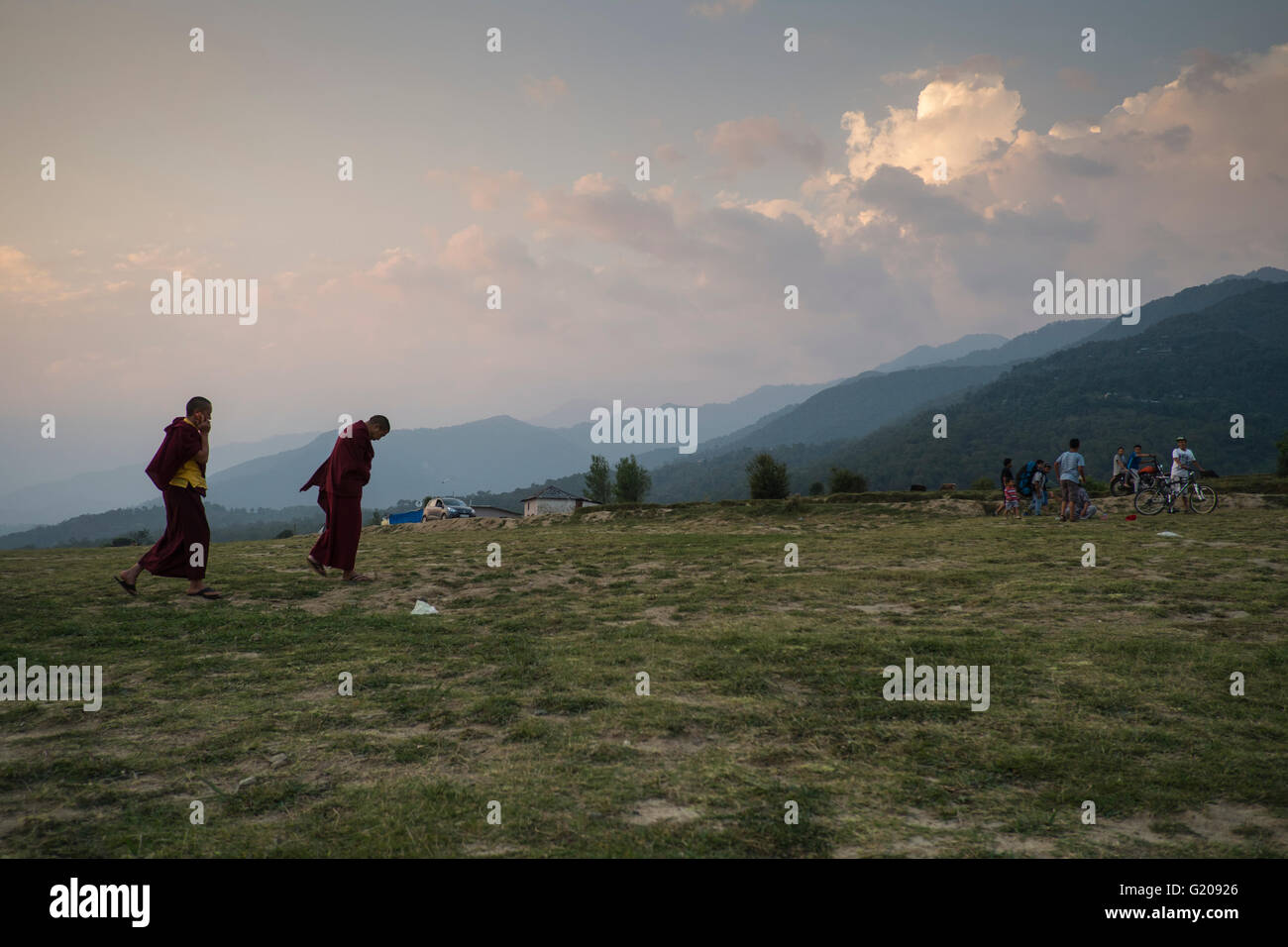 Two monks walk against the wind at the landing at Bir Billing, Himachal ...
