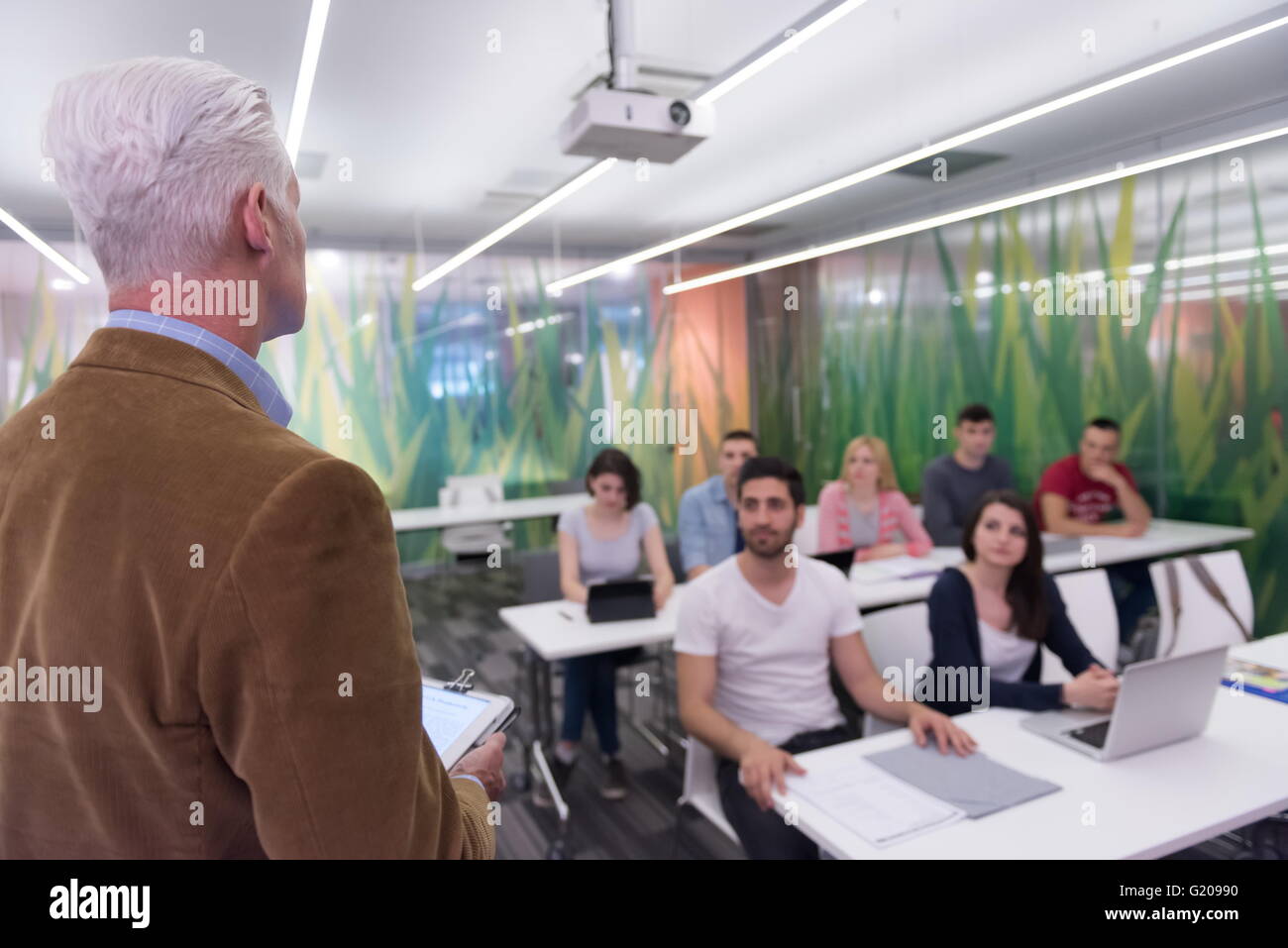 group of students study with professor in modern school classroom Stock ...