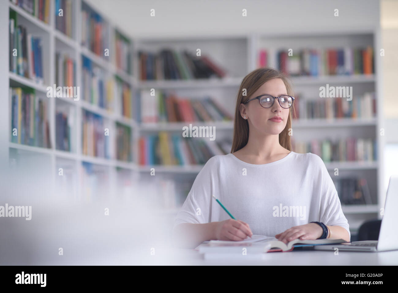 female student study in school library, using laptop and searching for ...