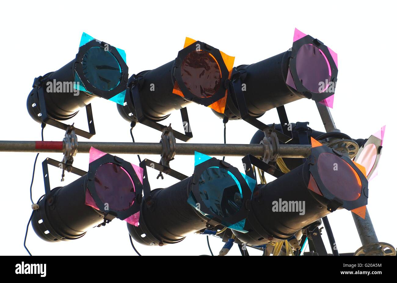 Multi-colored spotlights are mounted on metal poles Stock Photo - Alamy