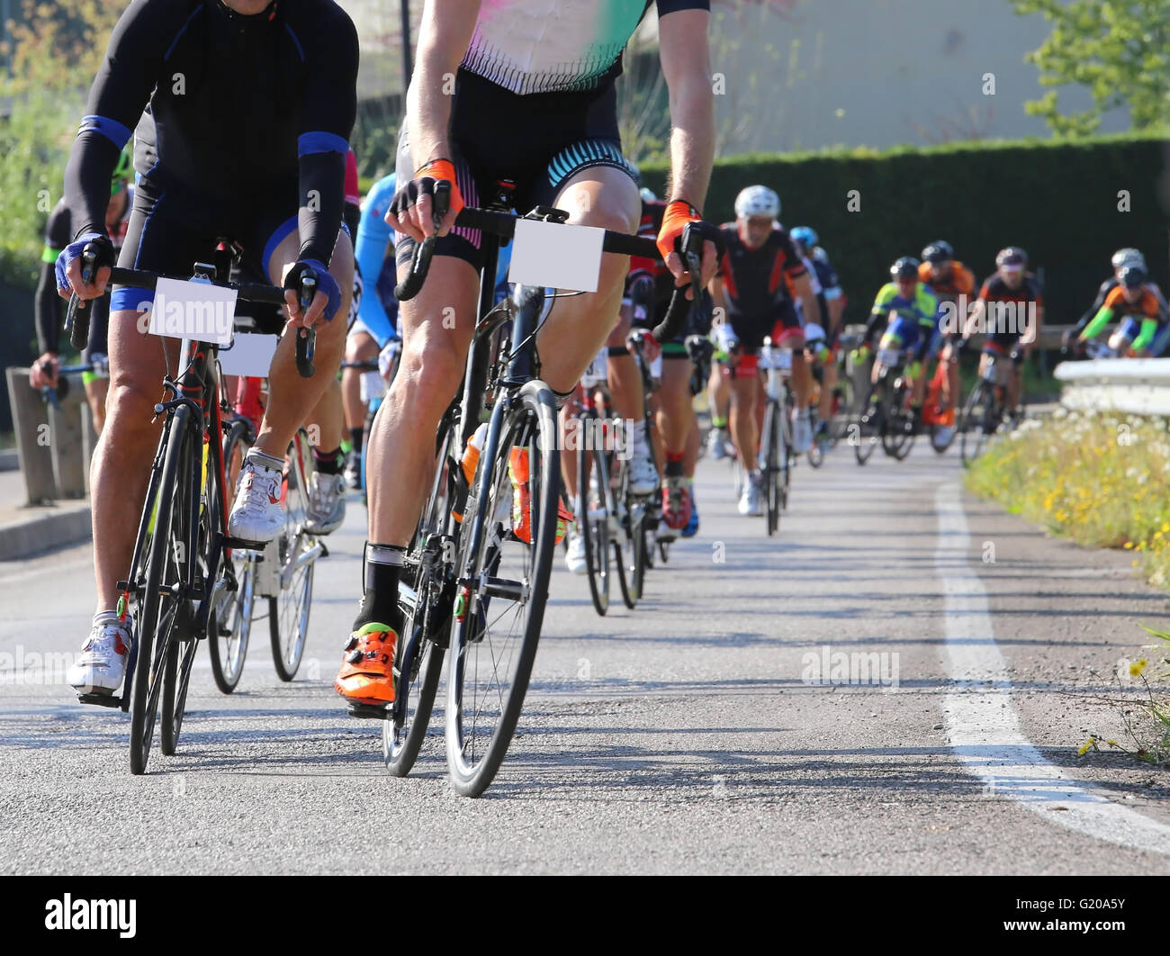 many racing bikes led by cyclists during the street race Stock Photo ...