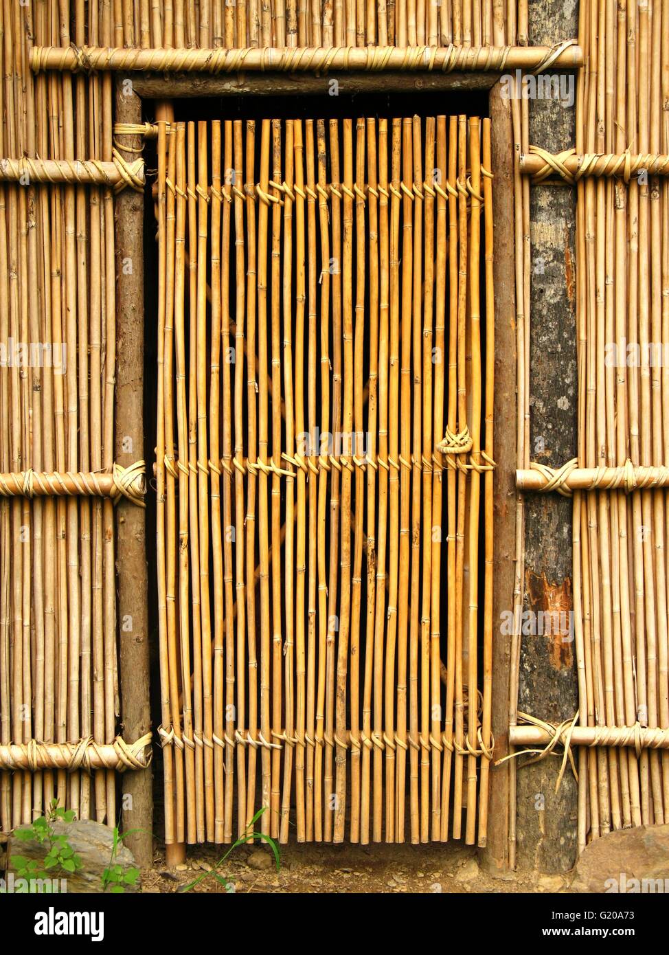 A handmade bamboo door leading to a native dwelling Stock Photo - Alamy