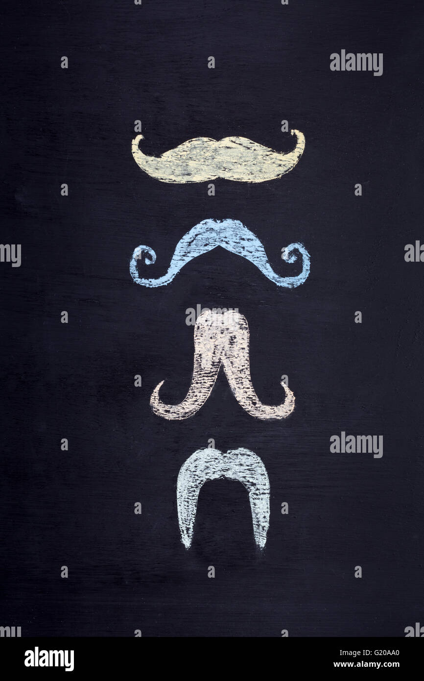 Set of colorful moustaches hand drawn with chalk on blackboard ...