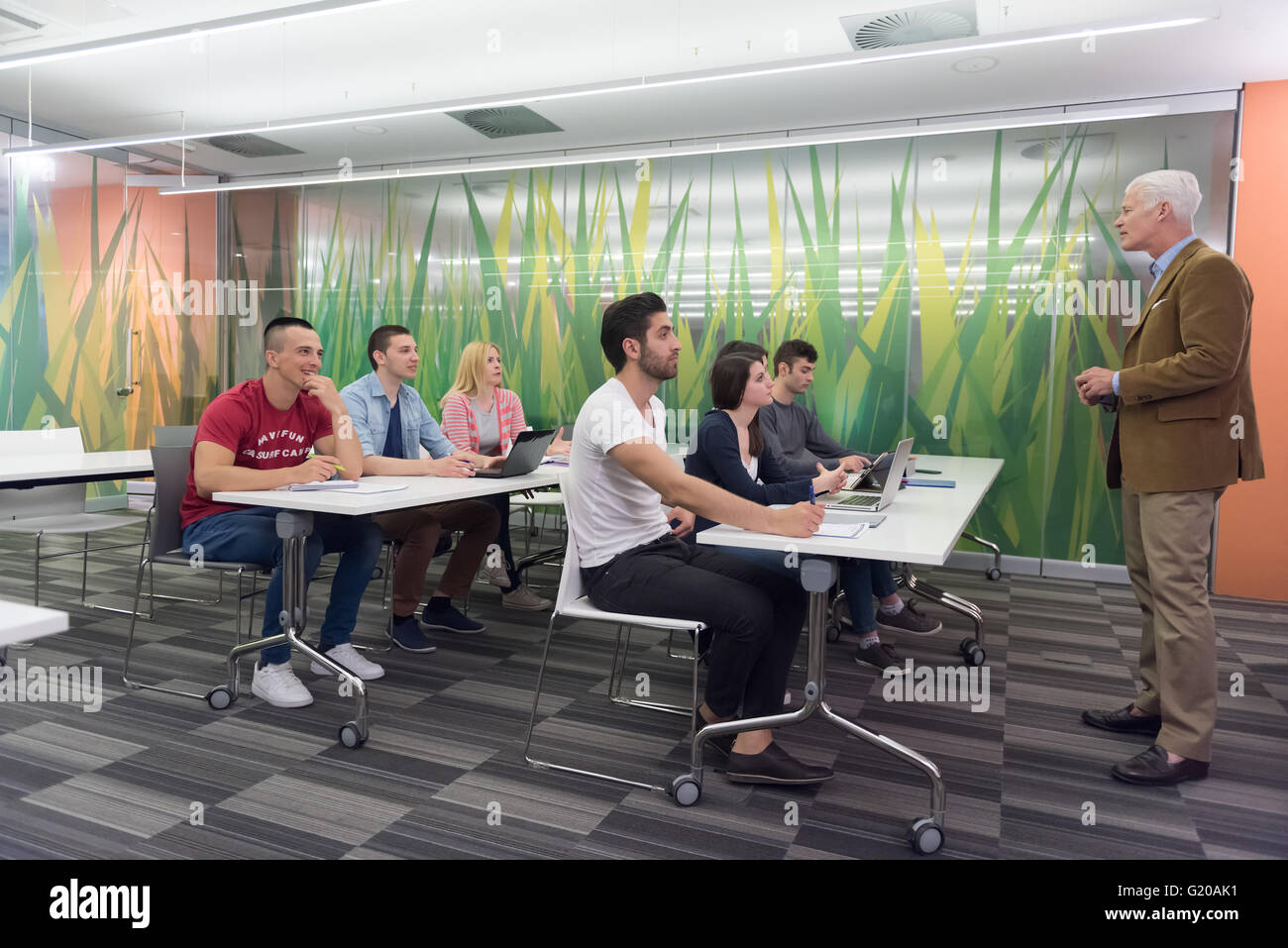 group of students study with professor in modern school classroom Stock ...