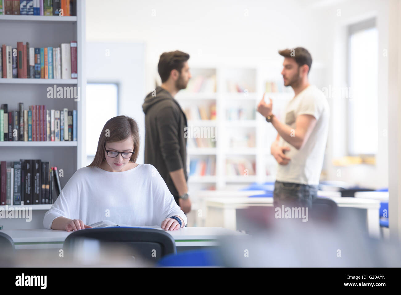 female smart looking student study in school library, group of students ...