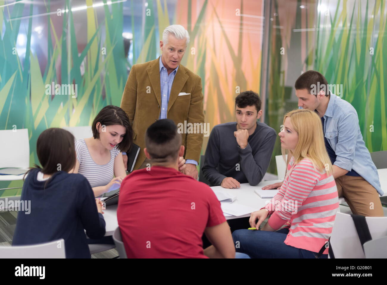 group of students study with professor in modern school classroom Stock ...