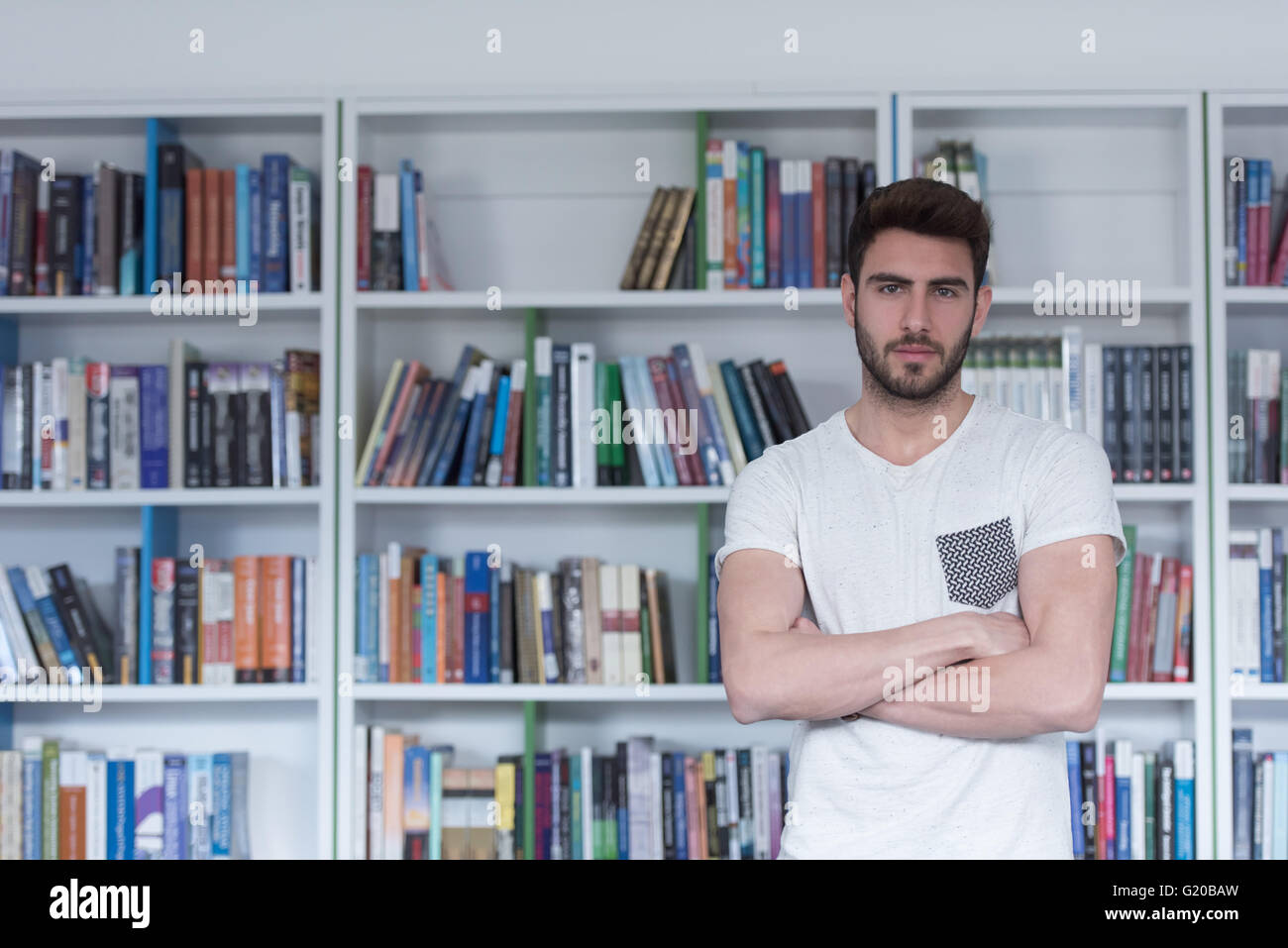 Student reading book in school library. Study lessons for exam. Hard ...