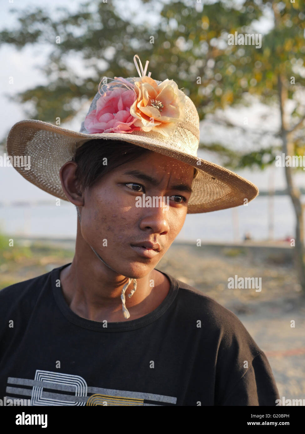 MYANMAR Man with flower hat Stock Photo - Alamy