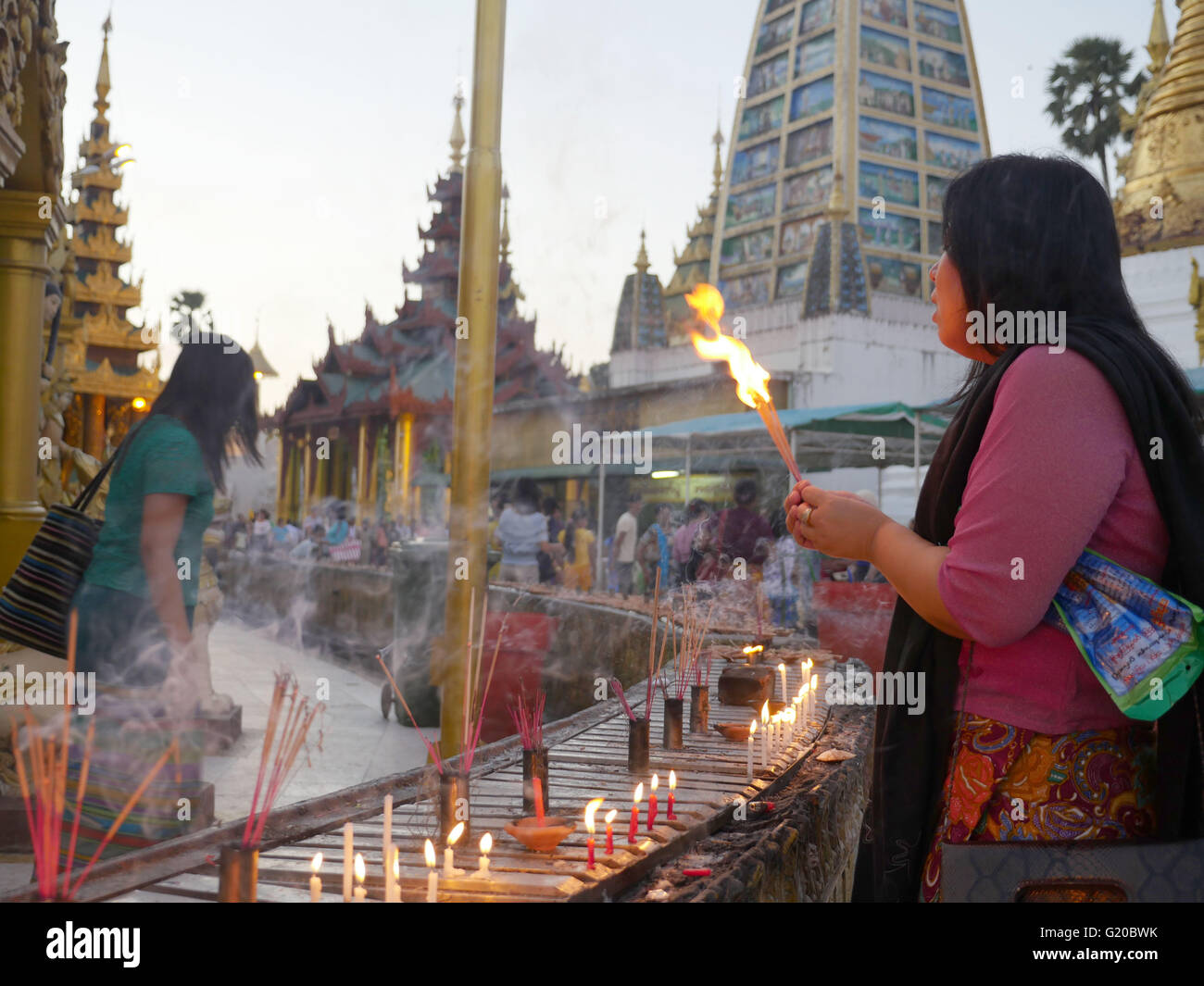 MYANMAR Shwedagon Pagoda, Yangon. Lighting candles Stock Photo - Alamy